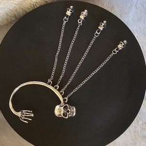 Silver Skull and Bone Hand Ear Cuff With Dangling Smaller Skulls. - Etsy