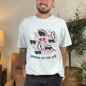 Spring in the Air Cotton Tee | Spring Skunks and Flowers Comfy T-shirt ...