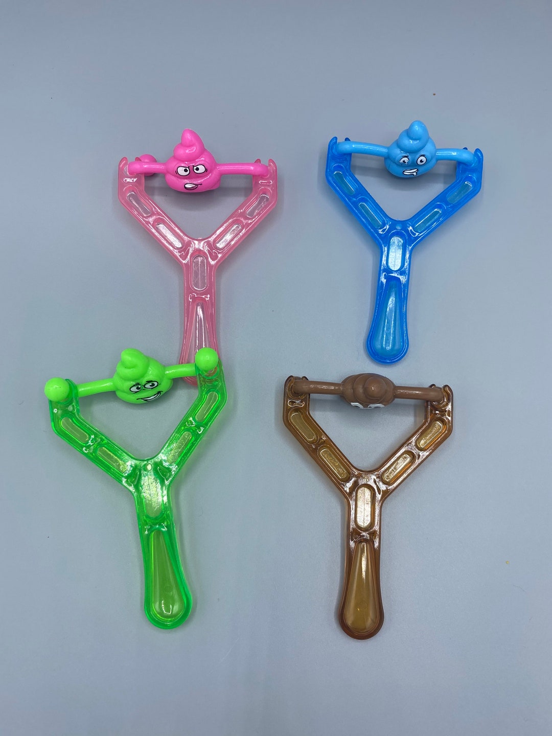 Slingshot Poop Joke Party Favours Games Gift Toys 2 Slingshots & 4 Pcs ...