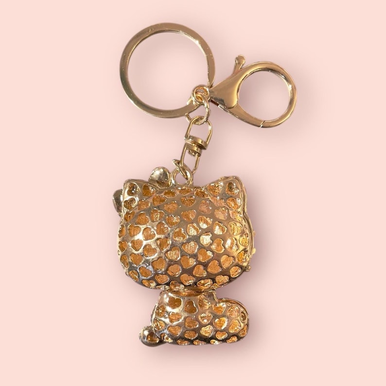 3-D Adorable Sanrio This **hello Kitty Rhinestone Keychain** Features ...