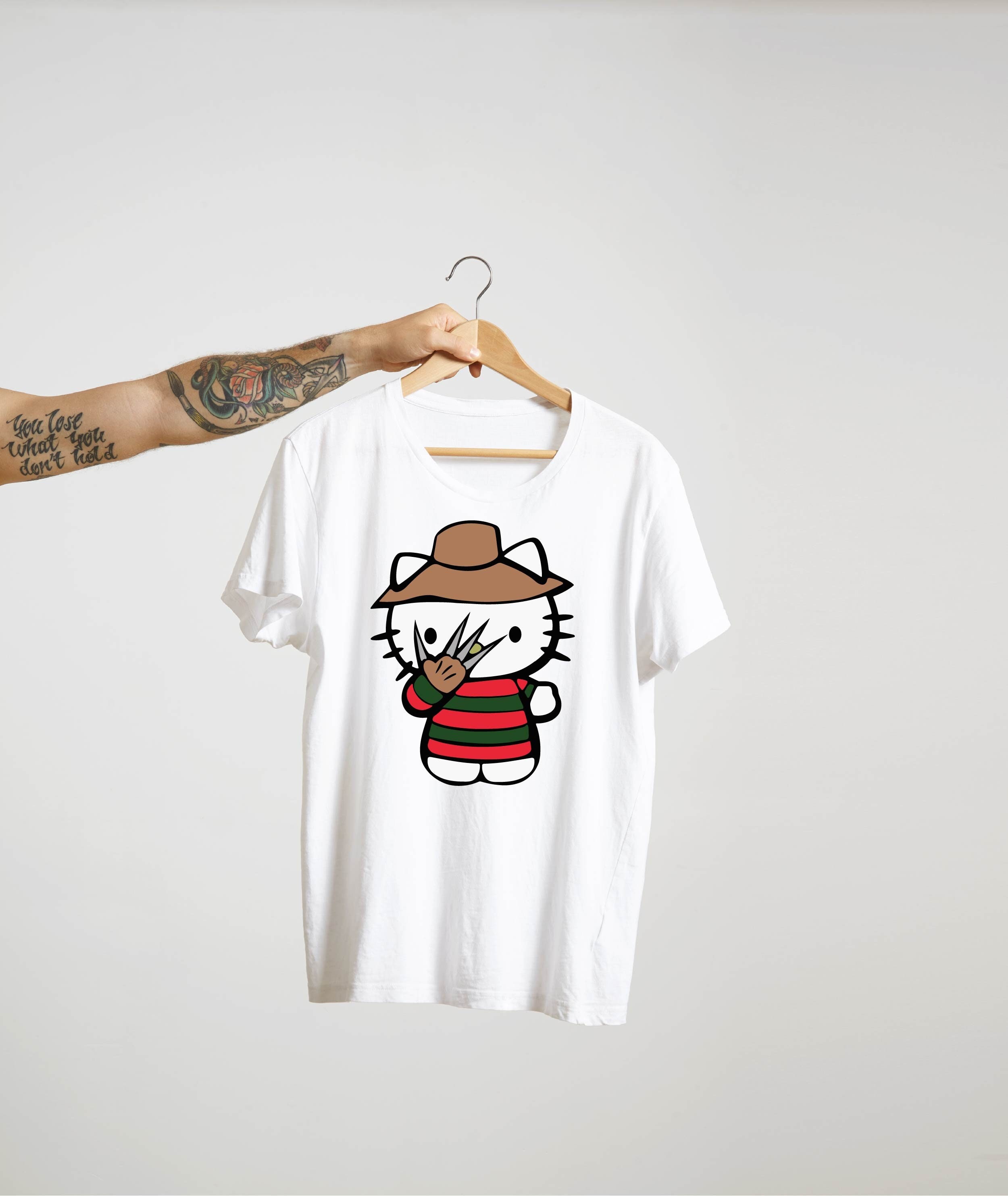 Hello Kitty With Crown Tattoo