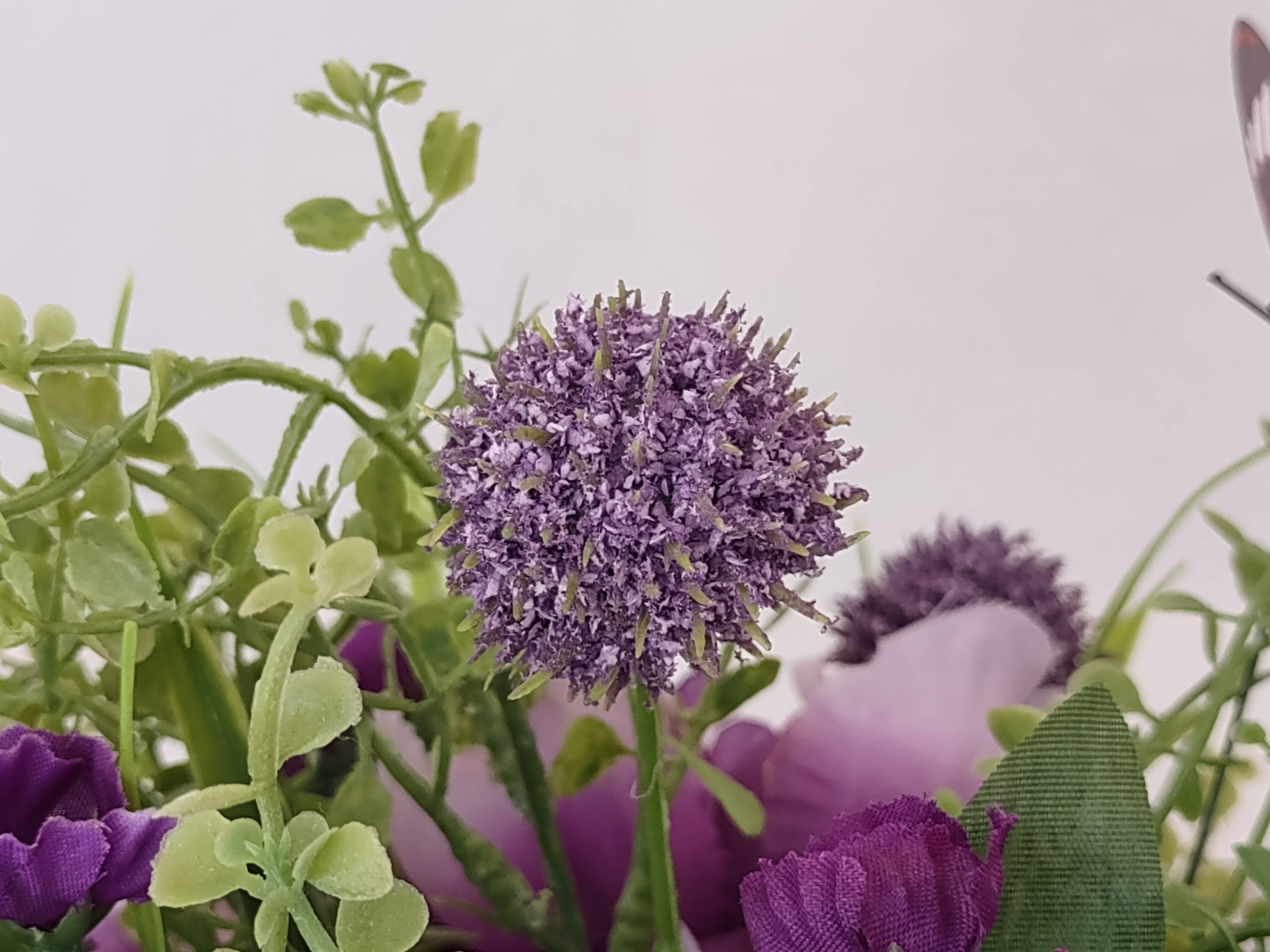 Centerpiece With Faux Purple Peonies, Statice, and Allium Balls in ...