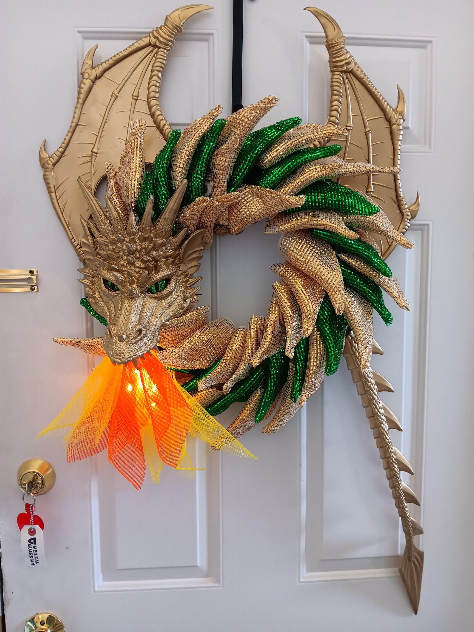 Gold and Green Dragon With Lighted Flame Beautiful Gold and Emerald ...