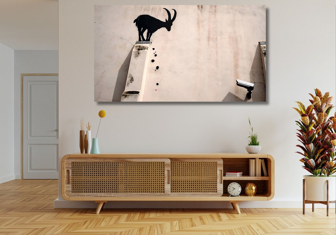 Banksy's Mysterious Goat Canvas Wall Art,banksy Goat Perched on the ...