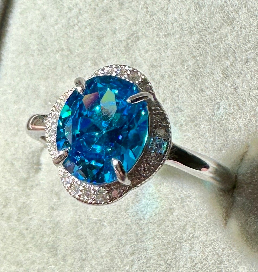 London Blue Topaz Oval Shaped Sterling Silver Adjustable Ring With CZ ...
