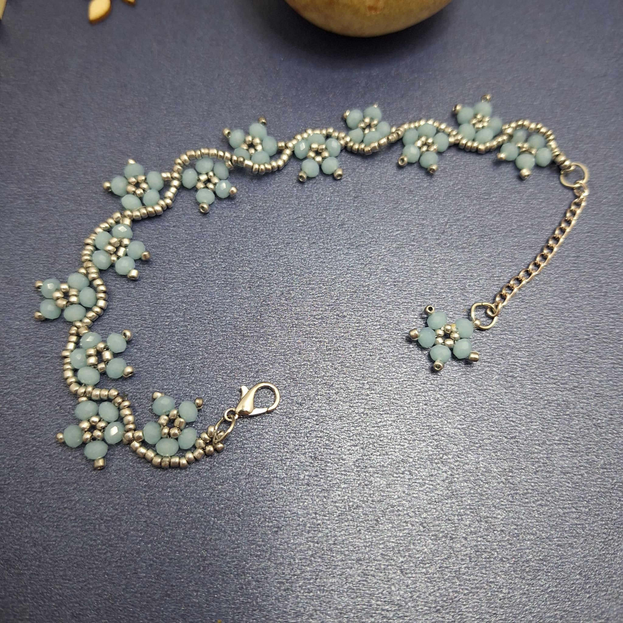 Beautiful Handmade Bracelet Features a Stunning Spiral Design With Cyan ...