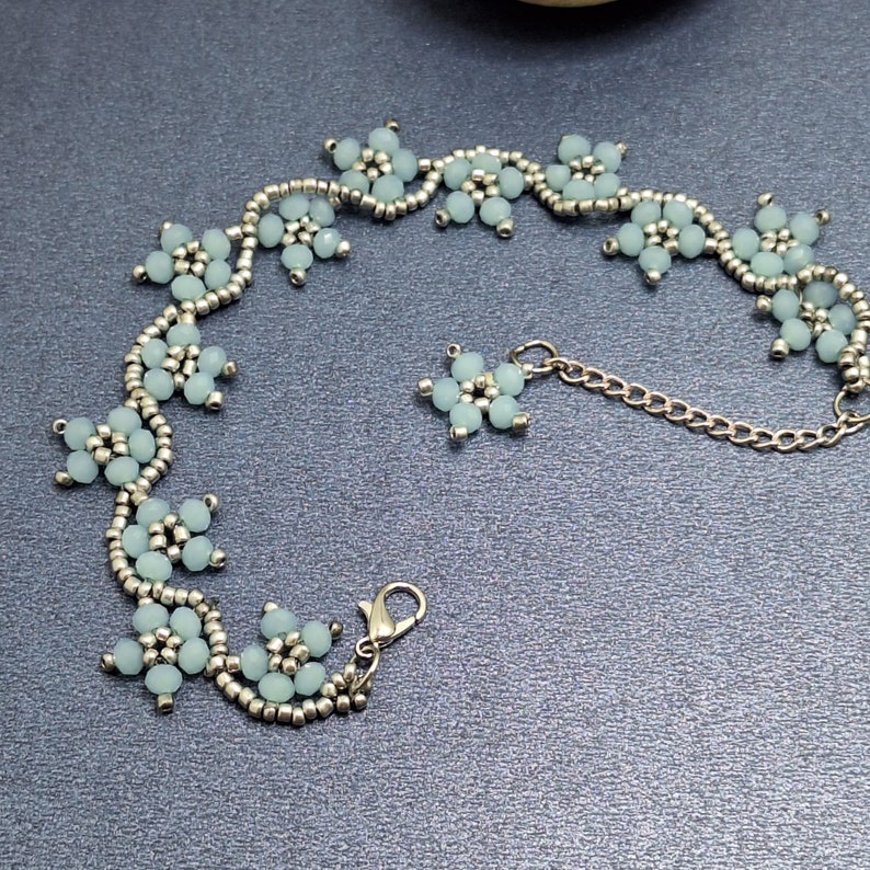 Beautiful Handmade Bracelet Features a Stunning Spiral Design With Cyan ...