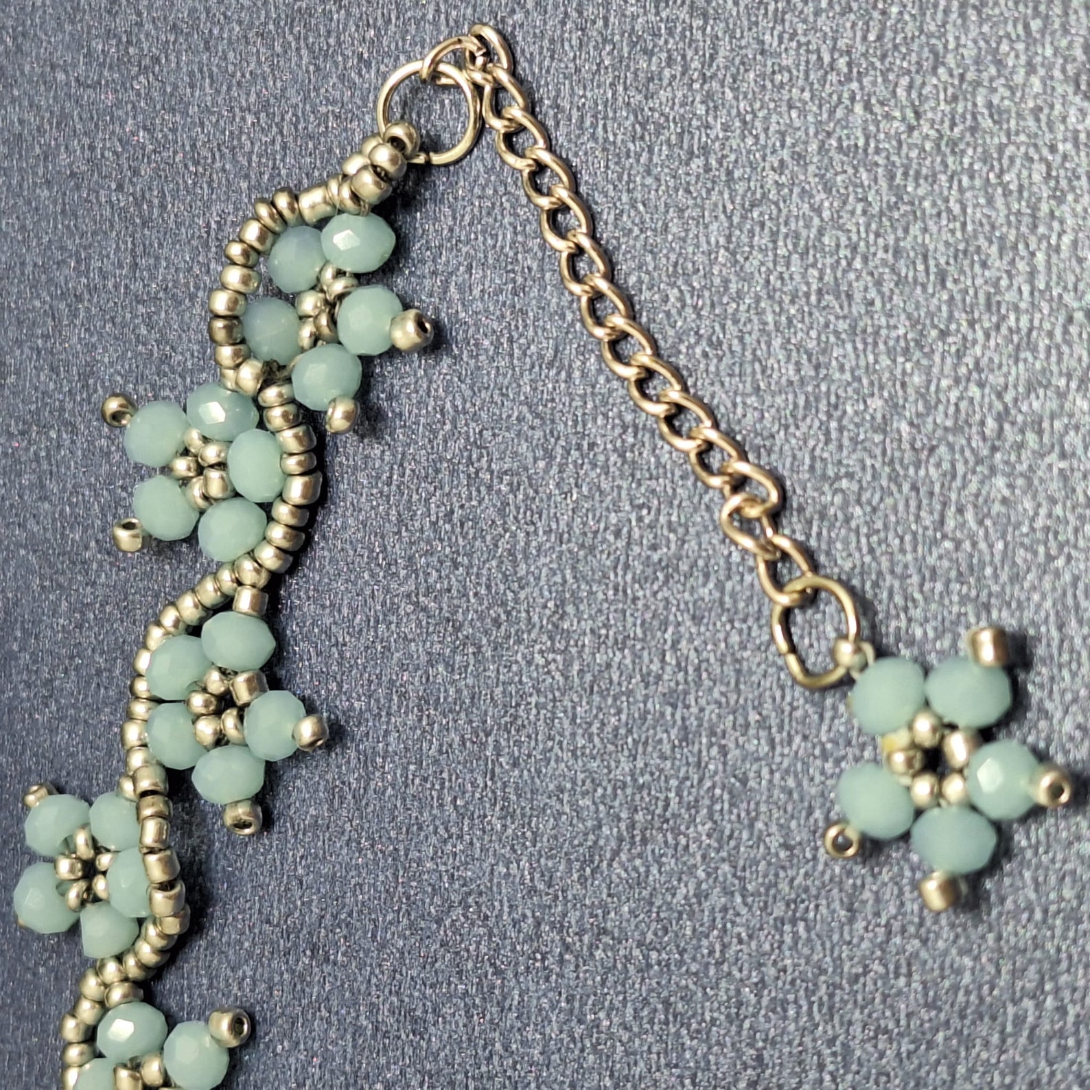 Beautiful Handmade Bracelet Features a Stunning Spiral Design With Cyan ...