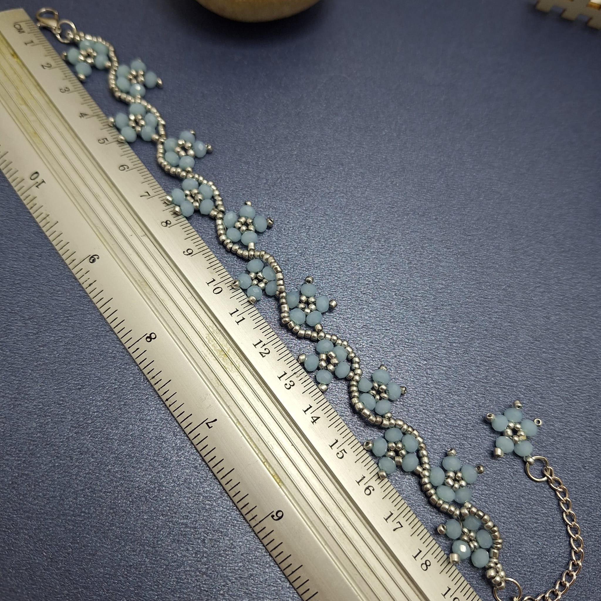 Beautiful Handmade Bracelet Features a Stunning Spiral Design With Cyan ...