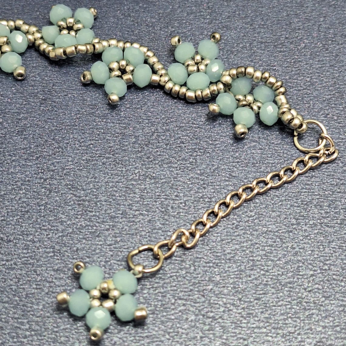 Beautiful Handmade Bracelet Features a Stunning Spiral Design With Cyan ...