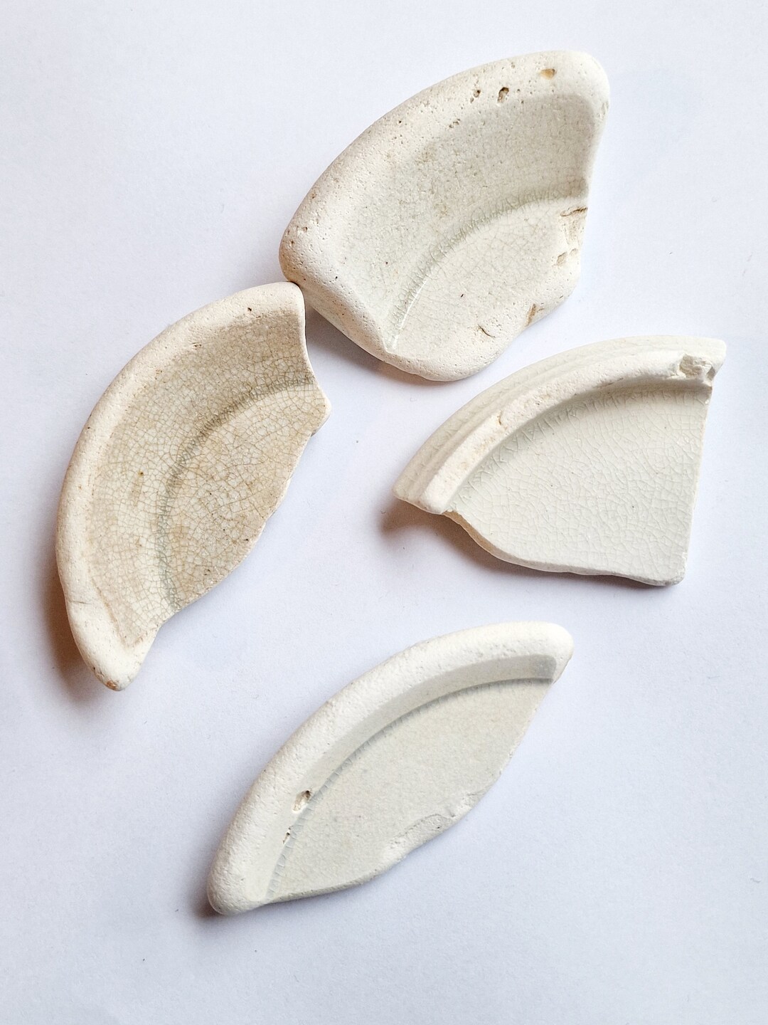 A Selection of 4 Beige Curved Pottery Pieces Broken Edges Plates Cups ...