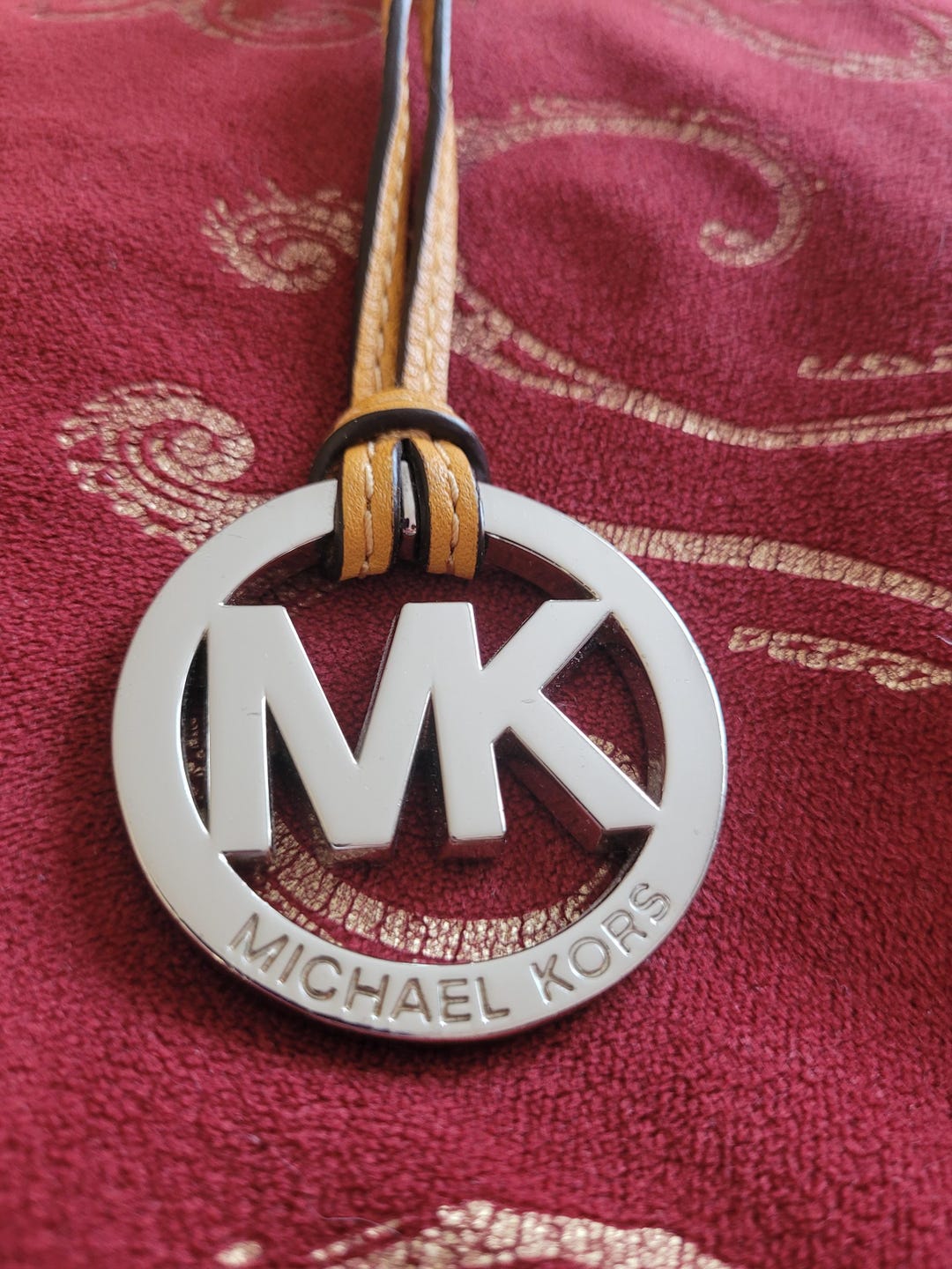 Michael Kors MK Silver Tone Circular Hang Tag on Mustard Yellow Leather ...