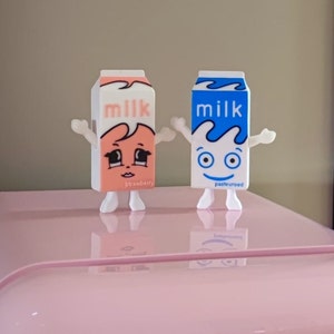 気まぐれな牛乳パックのキャラクター - 擬人化された男性と女性 - ブラーの「Coffee&TV」ビデオクリップ（1999）にインスパイアされ ...