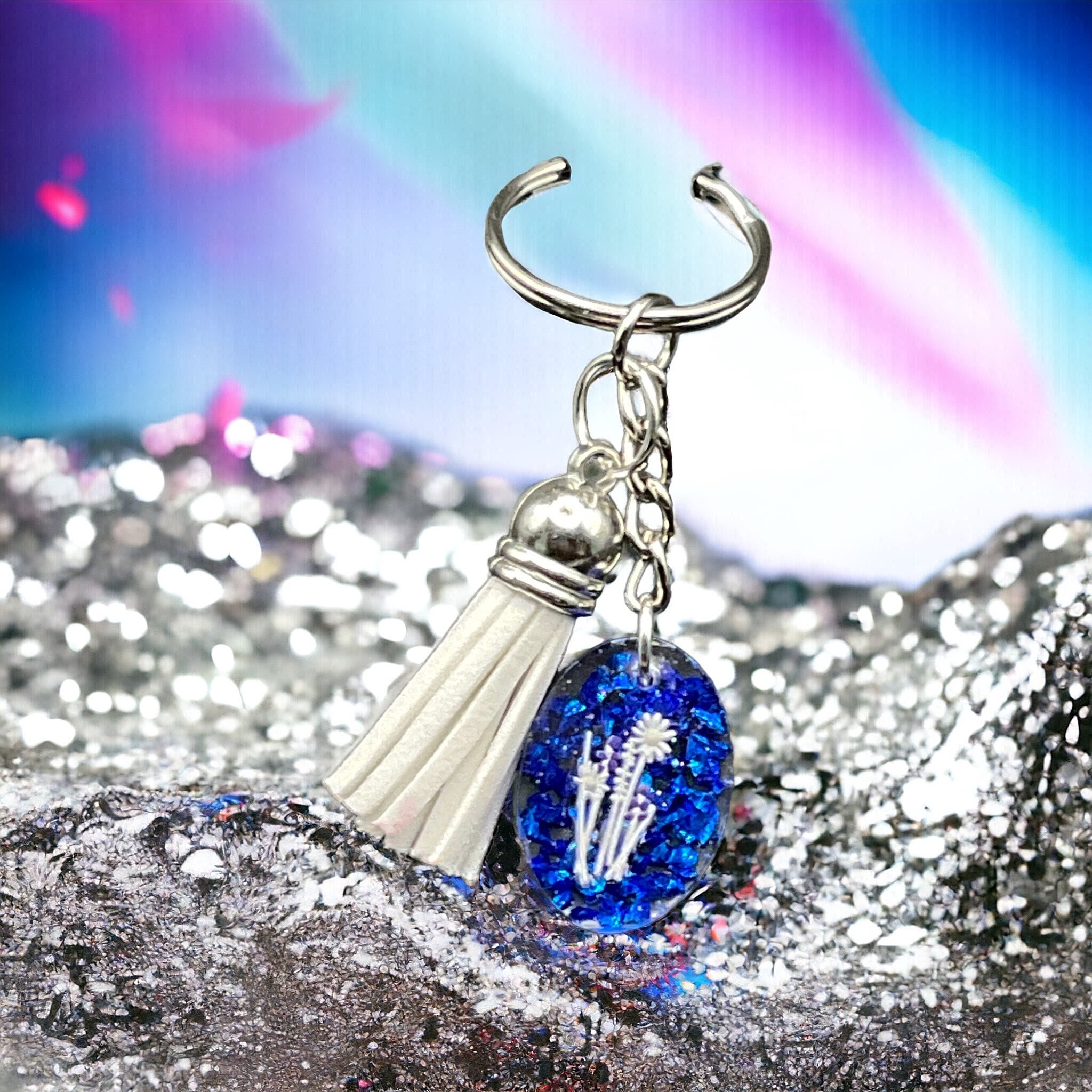Whimsical Blooms: Blue Glitter Keychain With Delightful Floral Art and ...