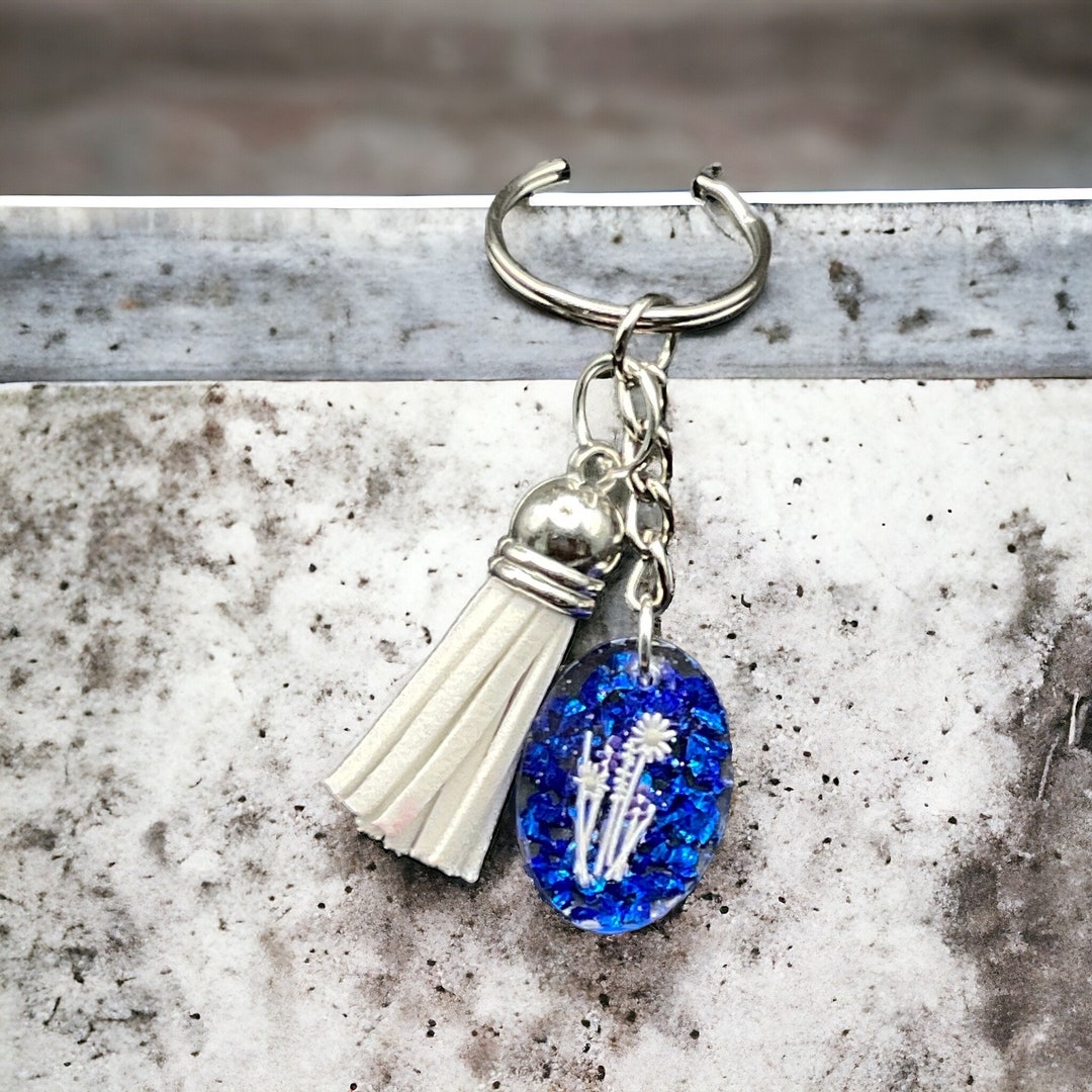 Whimsical Blooms: Blue Glitter Keychain With Delightful Floral Art and ...