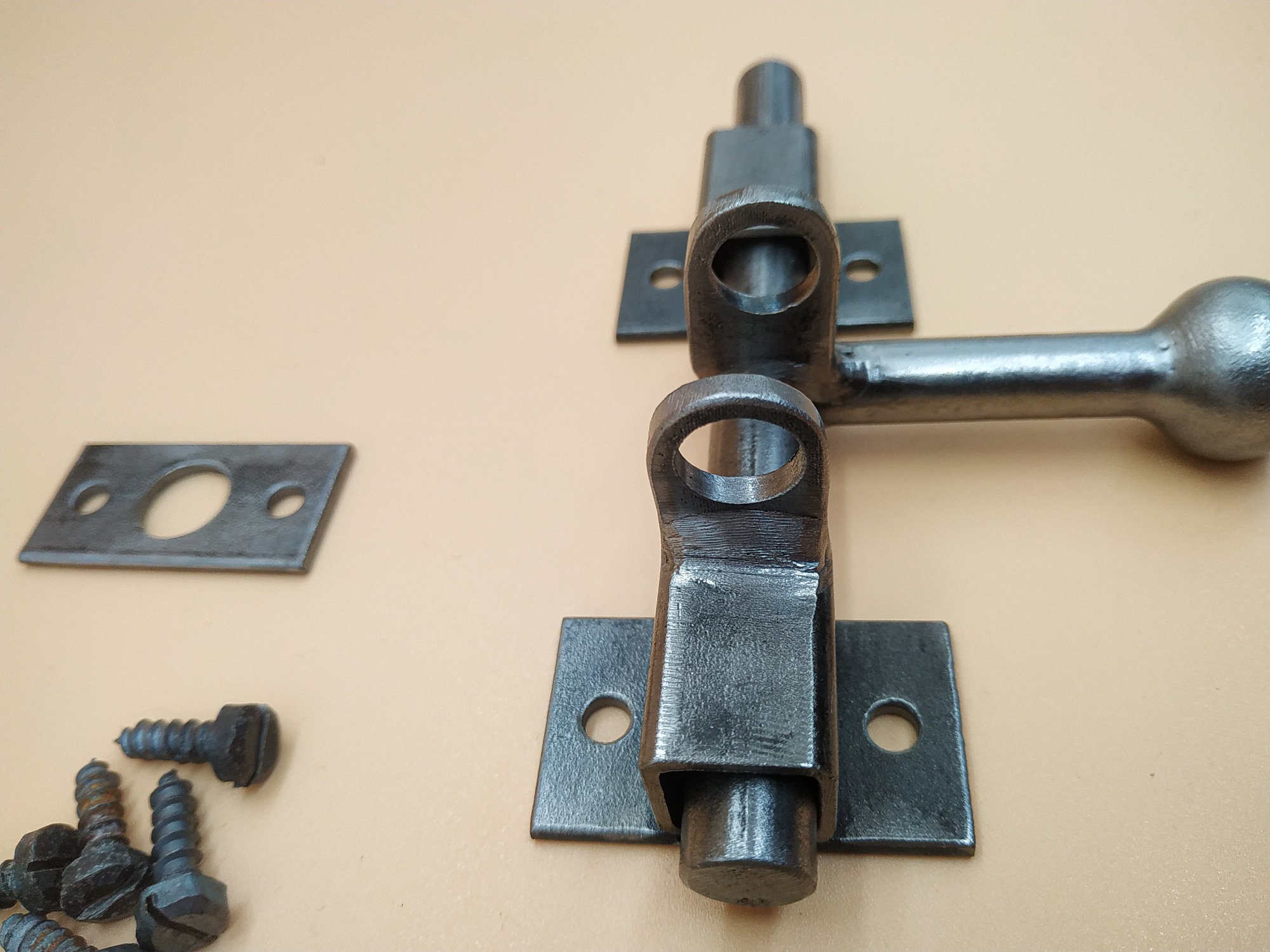 A Door Latch, Handcrafted in a Rustic Style, Ensures Reliable and Easy ...