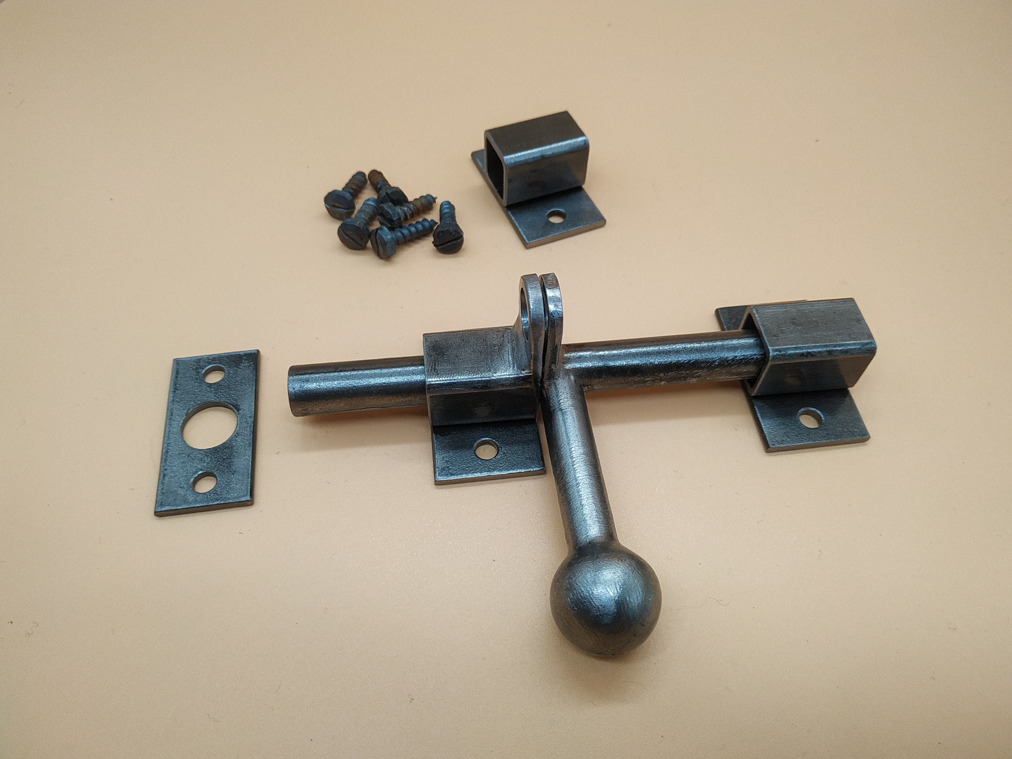 A Door Latch, Handcrafted in a Rustic Style, Ensures Reliable and Easy ...