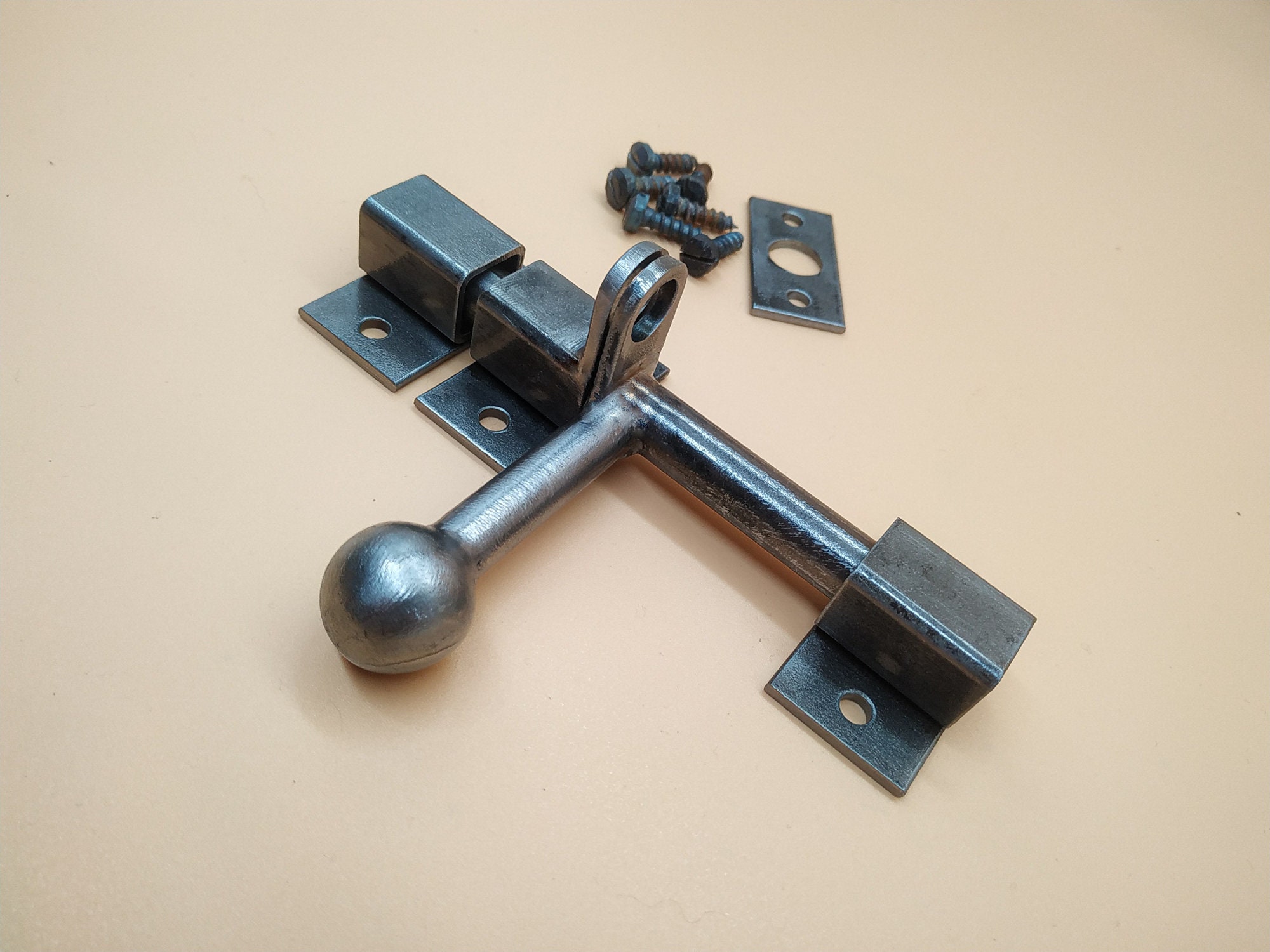 A Door Latch, Handcrafted in a Rustic Style, Ensures Reliable and Easy ...