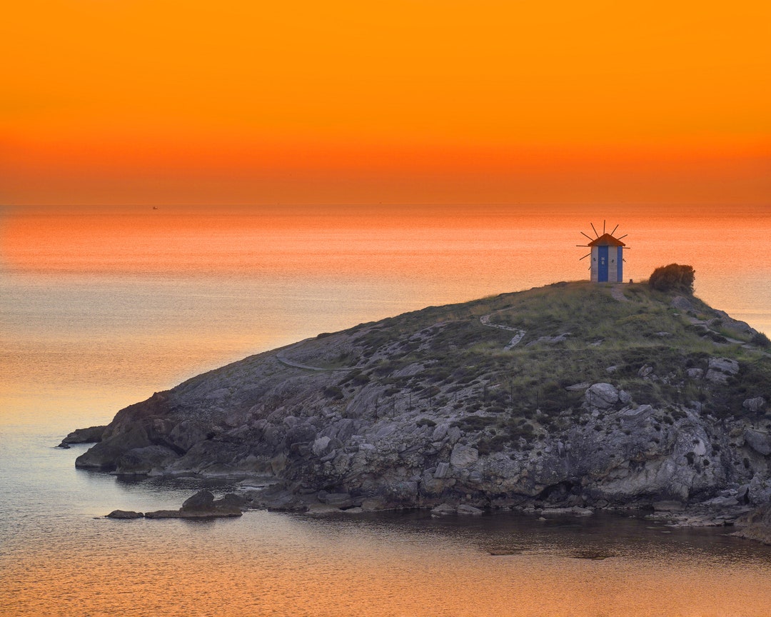 Turkey, Sile, Aglayan Kayalar, Windmill at Sunrise in Orange, Sunrise ...