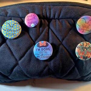 4-pack Theme Park Pinback Buttons, Lanyards, Backpacks, Pouches, Shirts ...