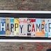 Happy Camper Sign Made With License Plate Letters Mounted on A Hand ...