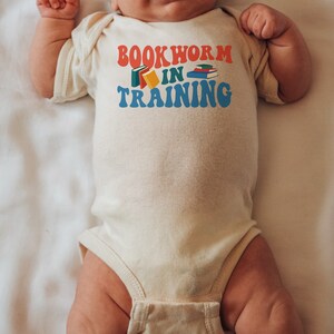 Bookworm in Training Baby Reveal Onesie® - School Librarian Baby ...