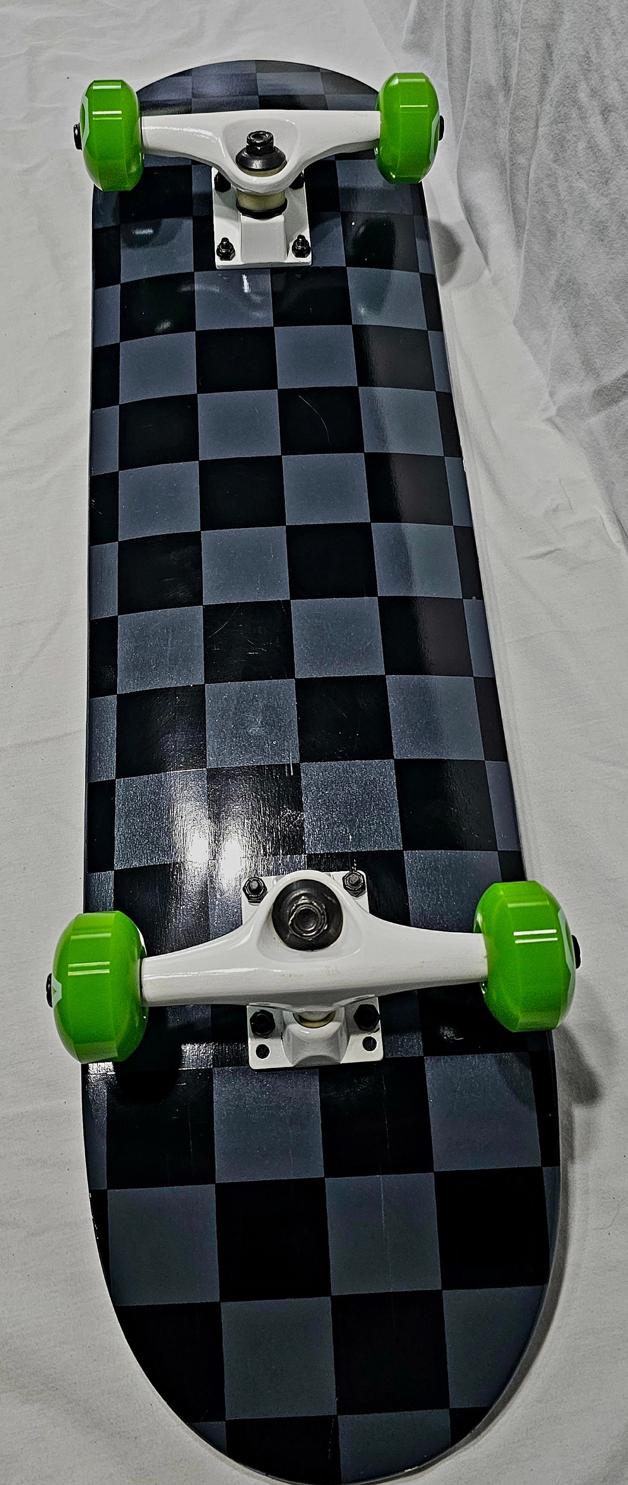 Checkered Skateboard Deck: Black & Gray, Unbranded Trucks, Green Wheels ...