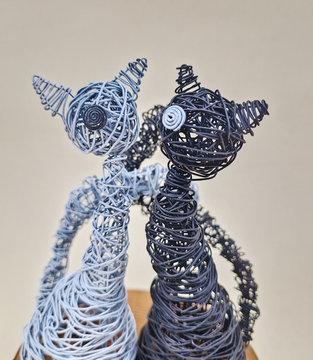 Love-expressing Wire Cat Sculpture: Black and White Pair on Wooden ...