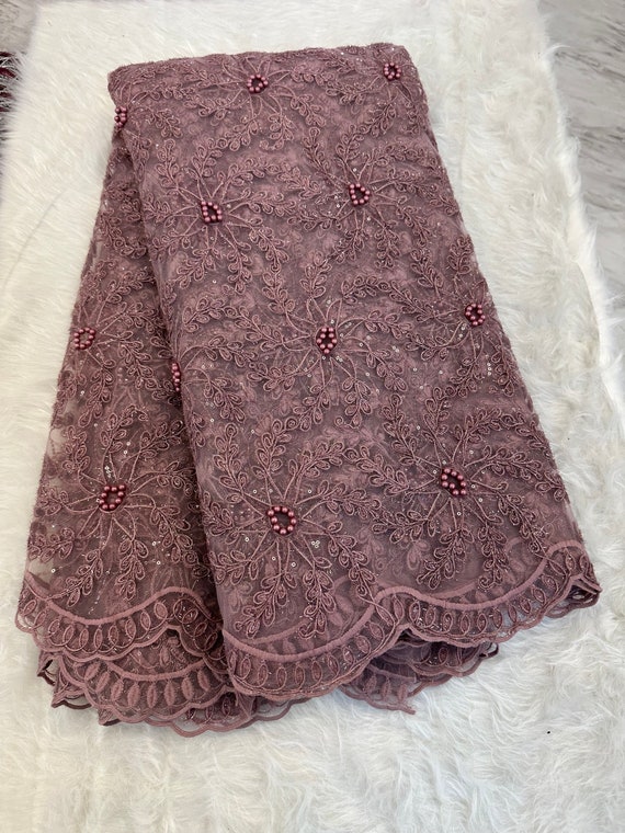 Mauve lace fabric store