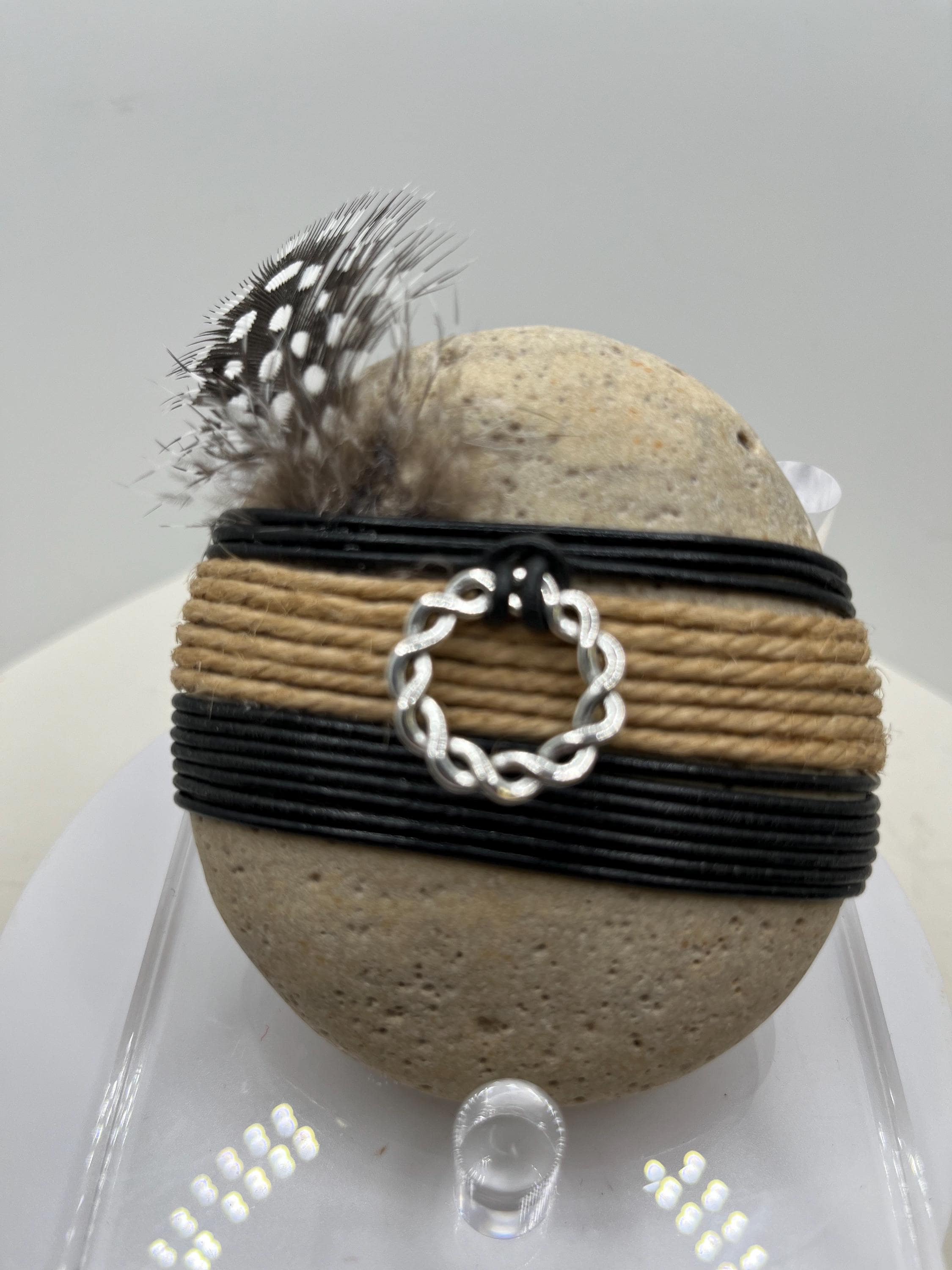 Natural Rock Wrapped in Rope and Leather, Embellished With Decorative ...