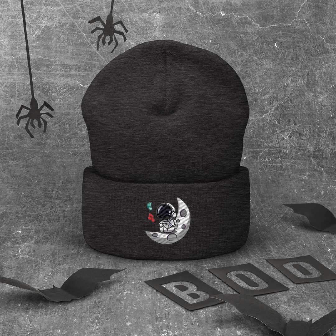 Cosmic Cuteness Unleashed: Adorable Astronaut on a Cartoon Moon Beanie ...
