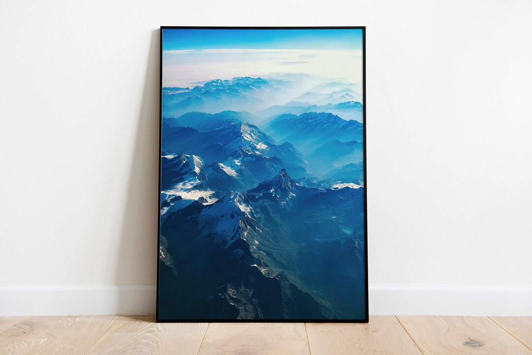Aerial Perspective: Majestic Mountain Peaks Shrouded in Clouds. Digital ...