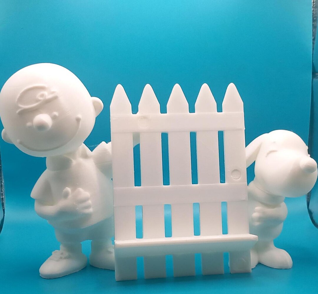 Peanuts-inspired 3D Printed Phone Holder Charlie and Snoopy Behind ...