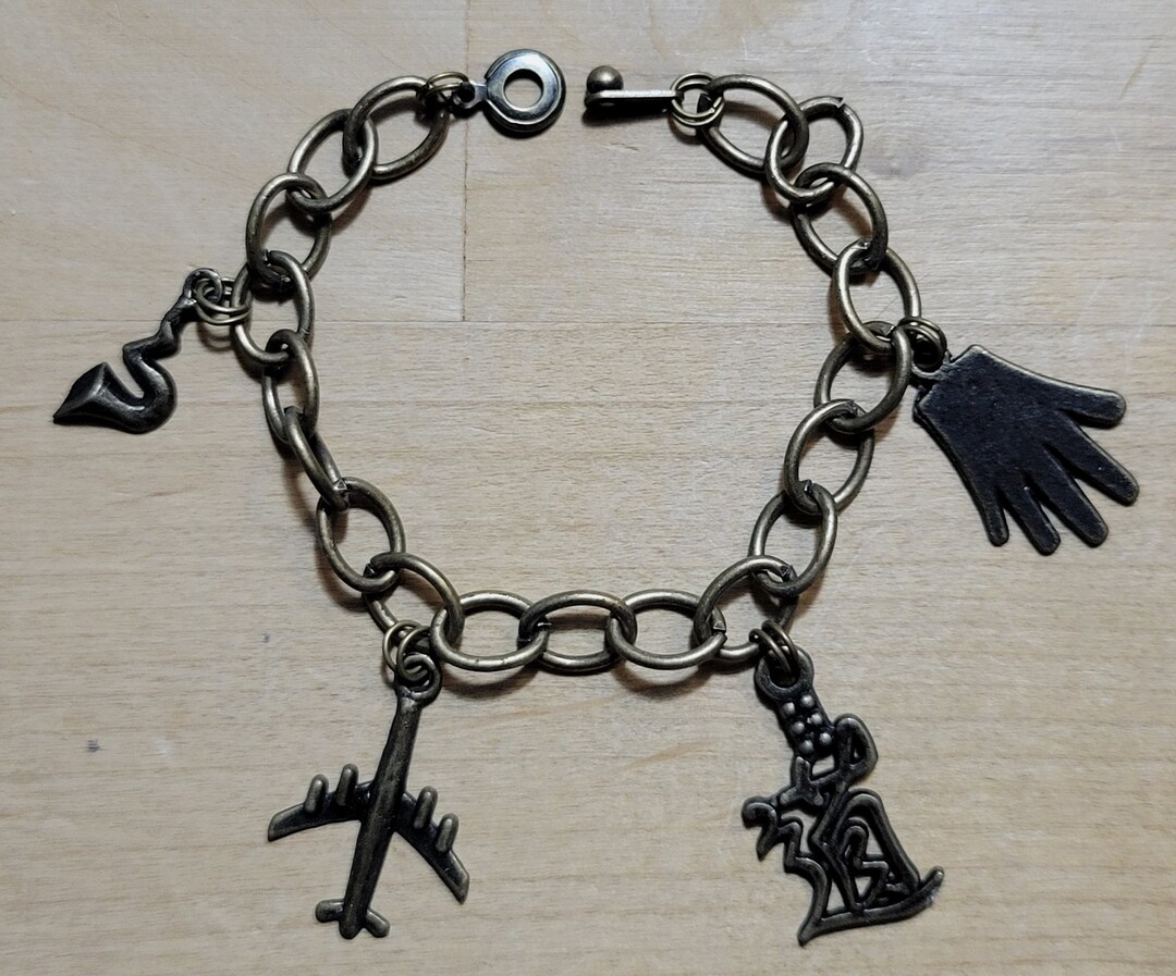 Good Luck Charm Bracelet Featuring Antique Gold Chain and Horn, Plane ...