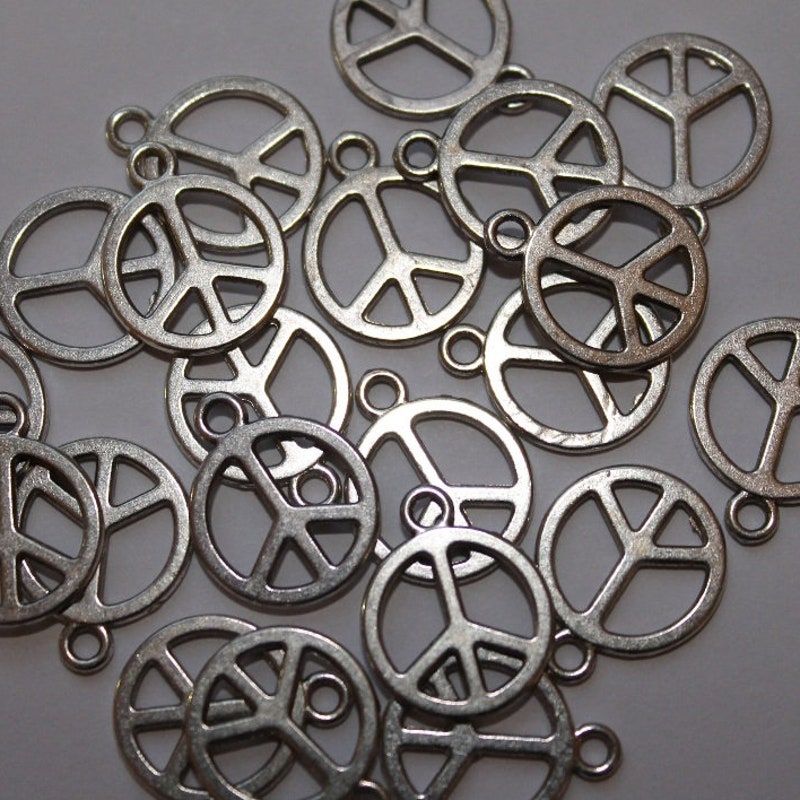 Tibetan Peace Sign Charms - Etsy UK
