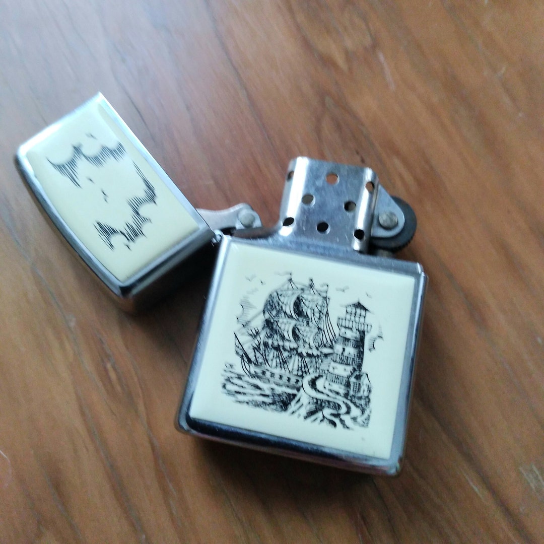 1989 Zippo Petrol Lighter. Scrimshaw Tall Ship and Lighthouse Design ...