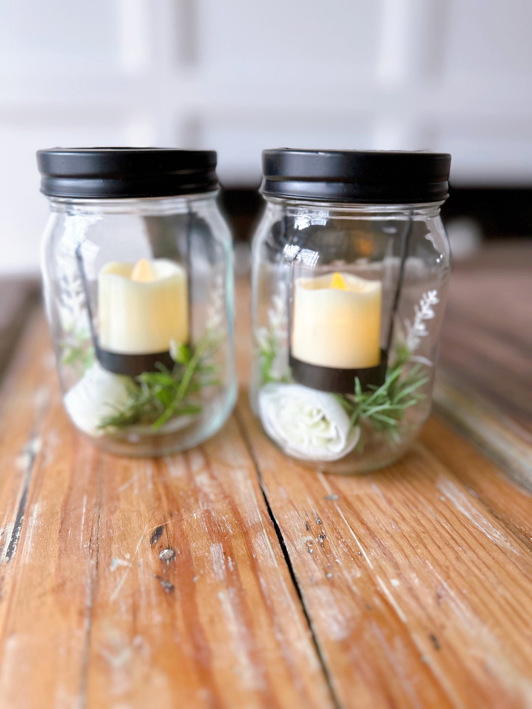 Set of Two Mason Jar LED Candle Lights With Green Foliage and White ...