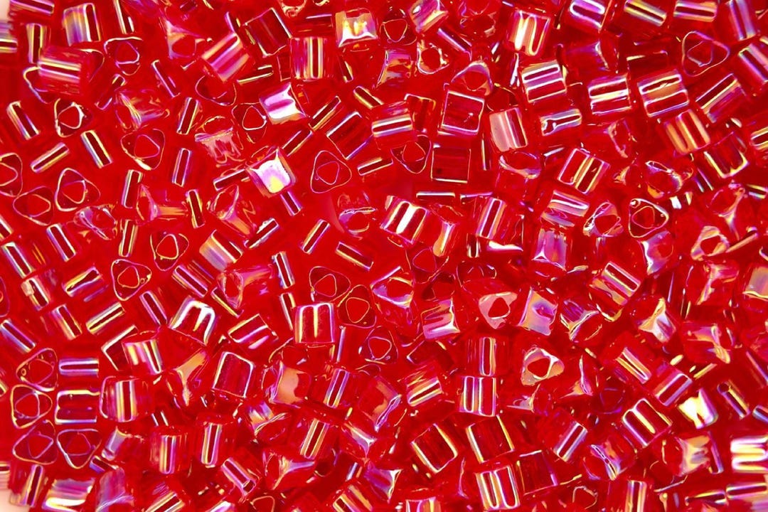 10g TOHO 8/0 Triangle Japanese Seed Beads 3mm 165C Trans Ruby Rainbow ...