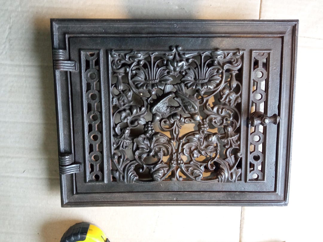 These Antique Cast Iron Fireplace Doors, Made Circa 1920s, Feature an ...