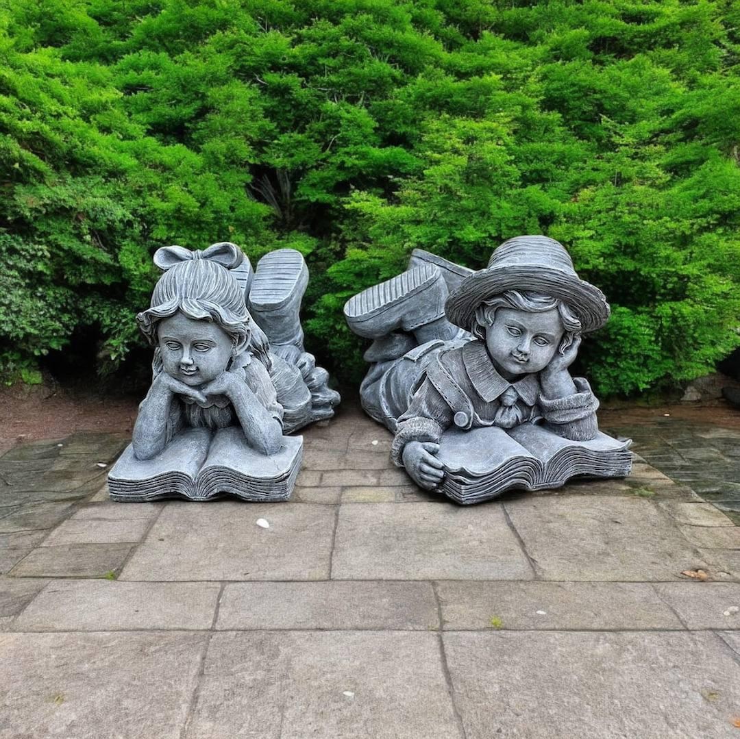 Two Kids Laying With Book Statue Massive Pair of Figures Boy and Girl ...