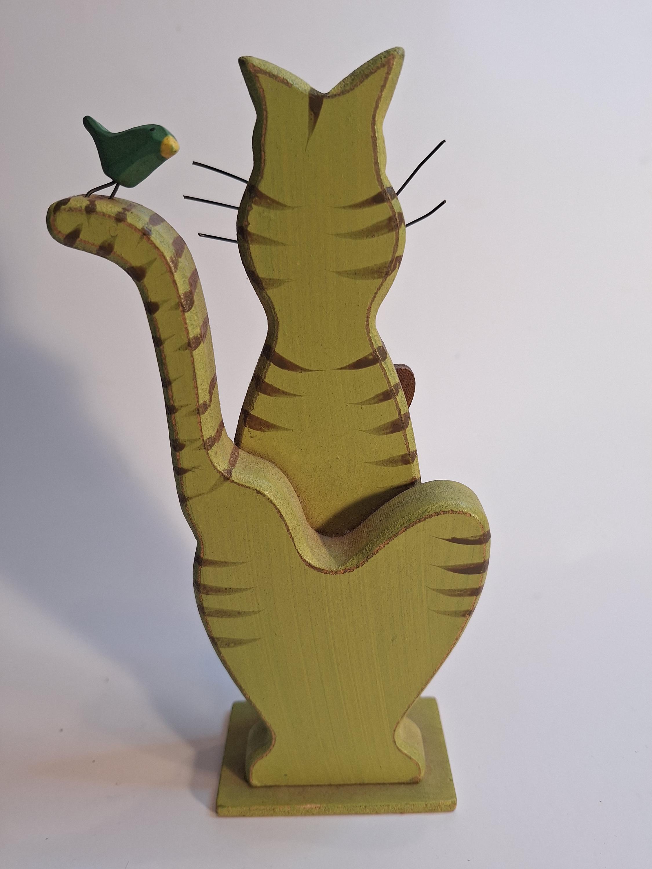 Wooden Olive Green Tabby Cat With Brown Stripes. Black Crow on His ...