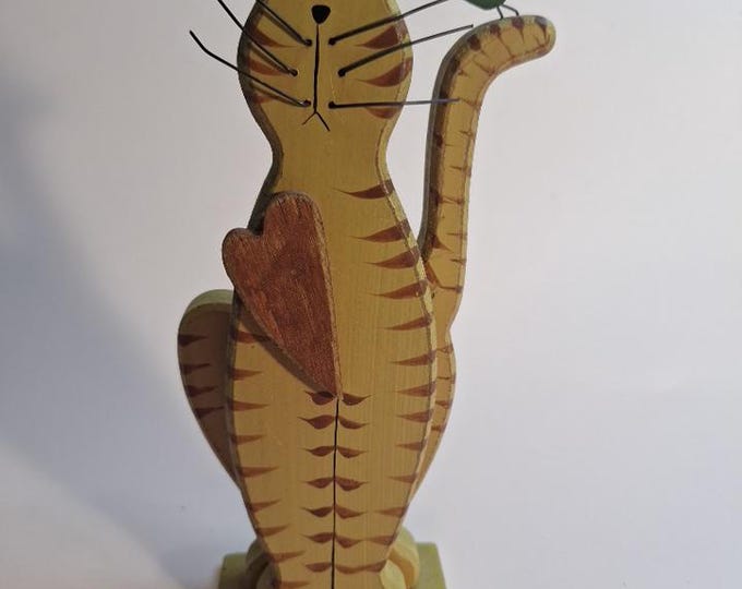 Wooden Olive Green Tabby Cat With Brown Stripes. Black Crow on His ...