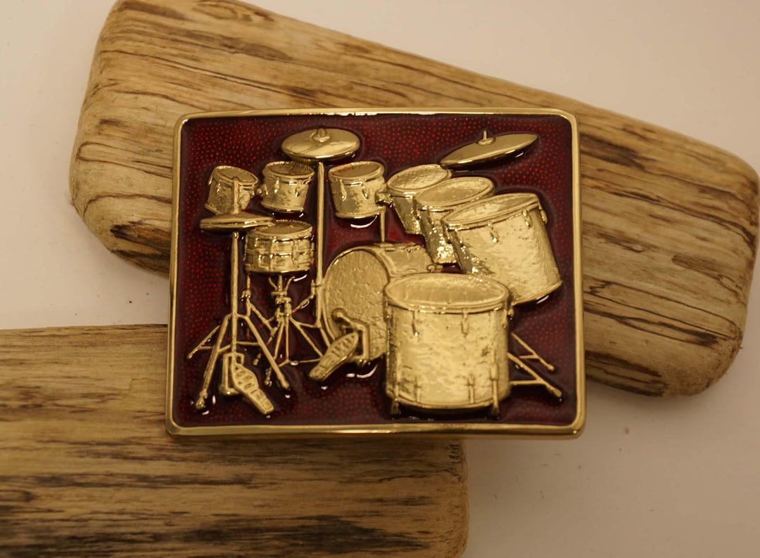 Buckle of a Gold-colored Drum Kit on a Red Background - Etsy