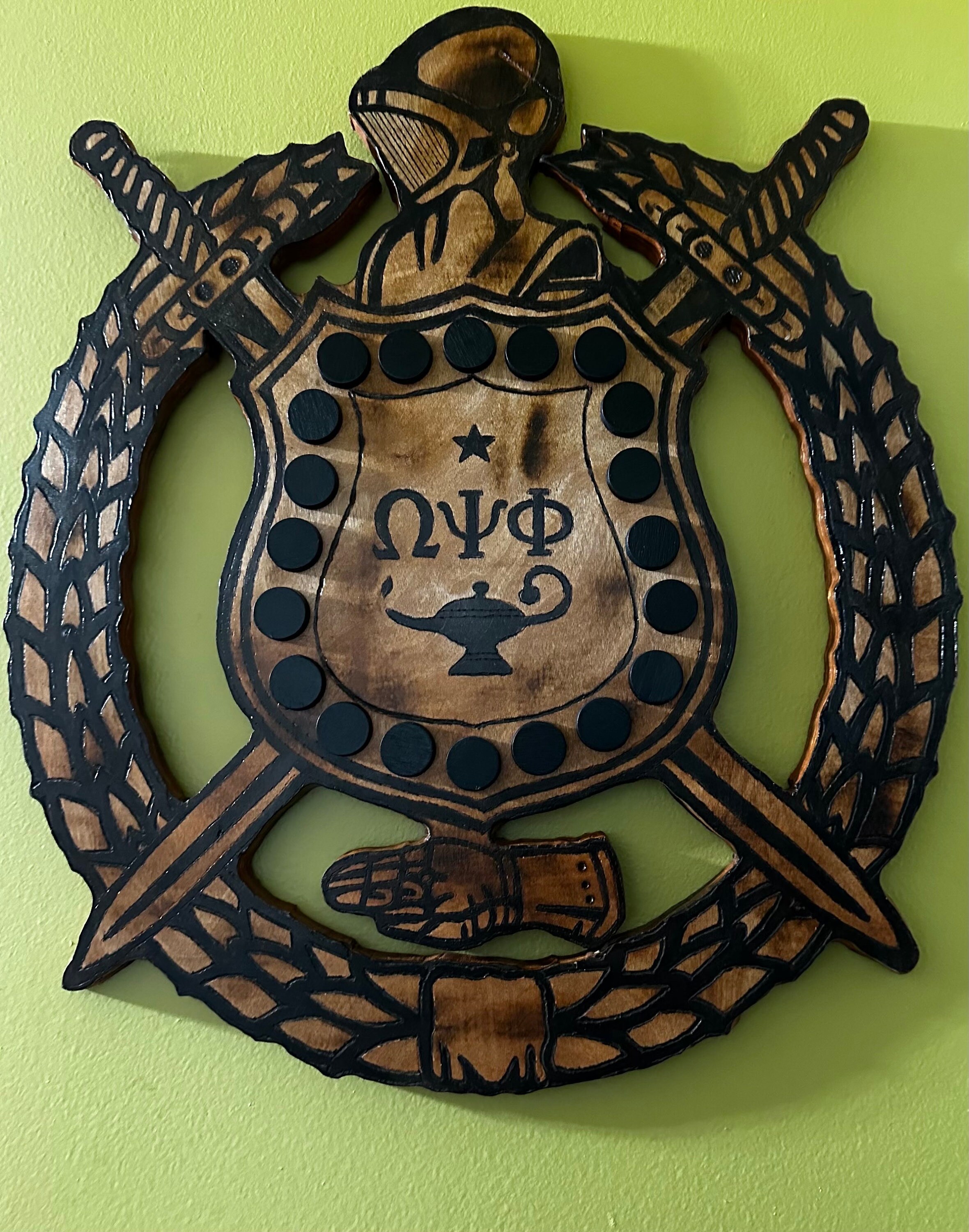 Omega Psi Phi Escutcheon