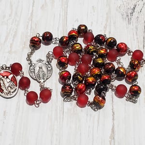 St. MICHAEL CHAPLET, Black Banded and Frosted Red Glass Beads, Silver Tone Components, W ...
