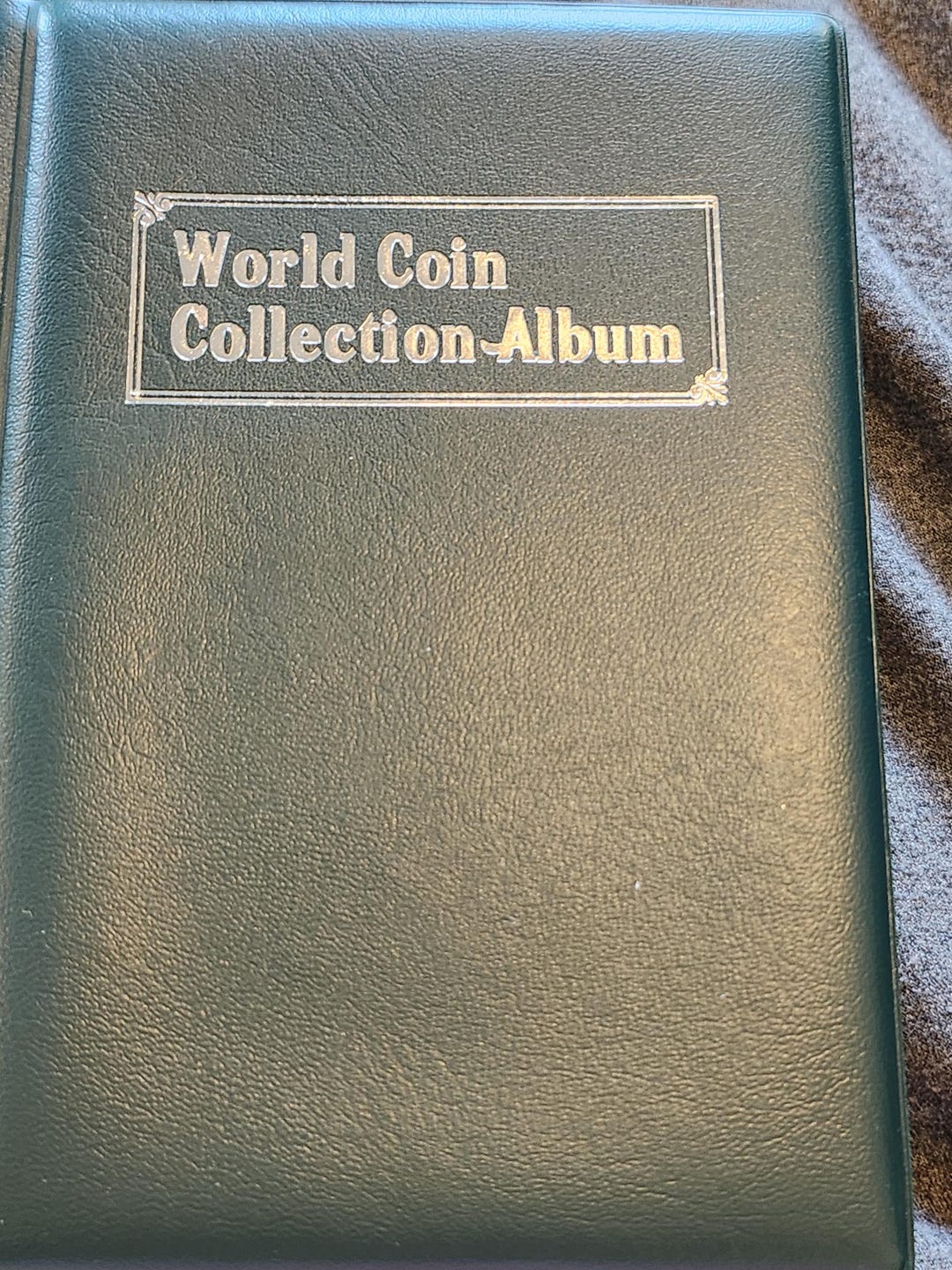 Small World Coin Collecting Album With 12 Individual Circulated Coins ...