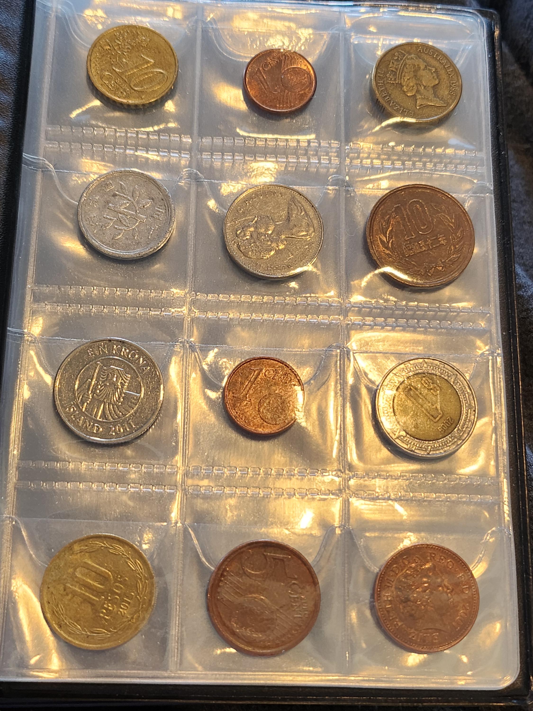 Small World Coin Collecting Album With 12 Individual Circulated Coins ...