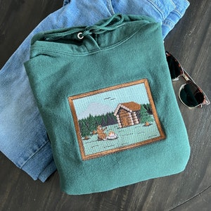 Sasquatch Log Cabin Scene Embroidered Hoodie Sweatshirt Unisex Camping ...