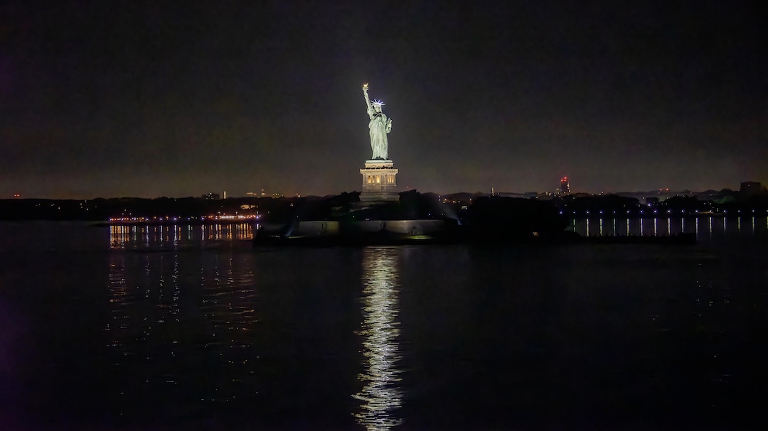 The Stature of Liberty at Night Reflected in the Water Canvas or Paper ...
