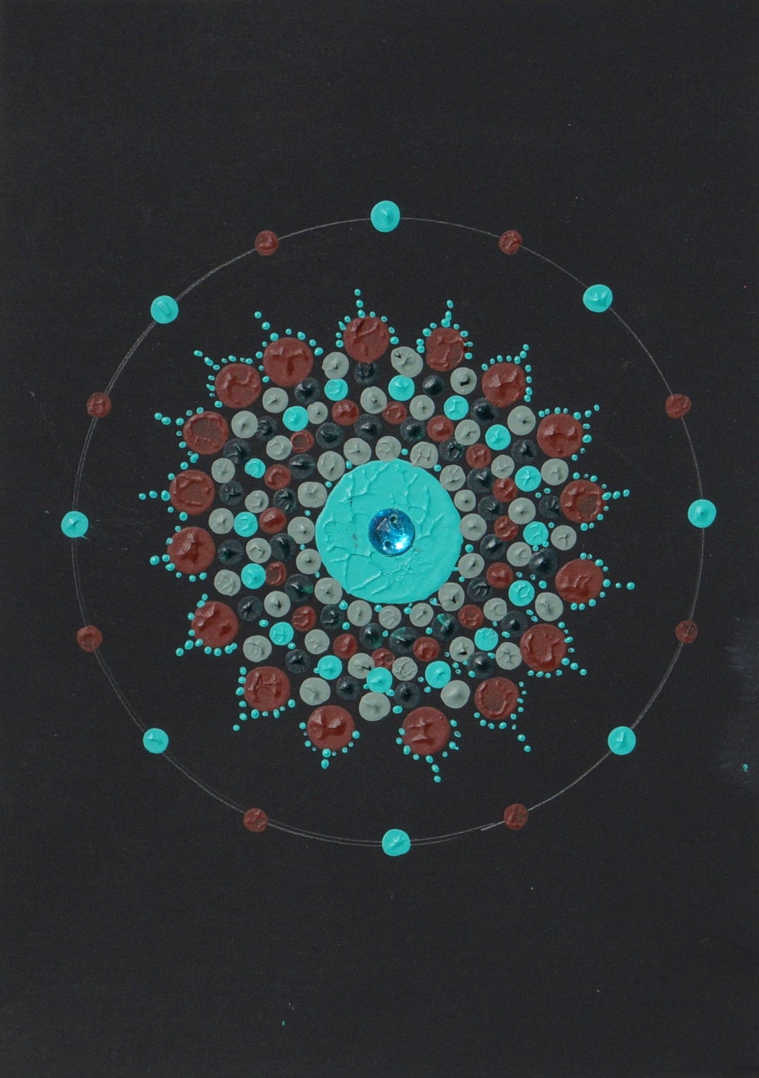 A Circular Pattern of Turquoise, Red and Black Dots on a Black ...